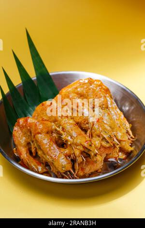 A Thai-style dish with wok-fried vegetables and noodles, garnished with ...