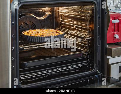 baked In the oven homemade pie stuffed with cheese and mushrooms on a ...