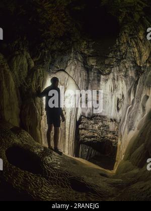 Man exploring the mysterious and natural beauty of Spar Cave on the ...