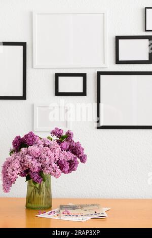 Beautiful blooming lilac flowers with magazines on bed Stock Photo - Alamy