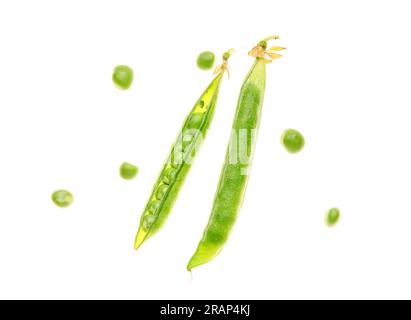 Flying green pea pods on white background Stock Photo - Alamy