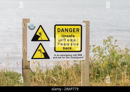 Danger unsafe cliff edge warning sign, Swanage, Dorset, UK Stock Photo ...
