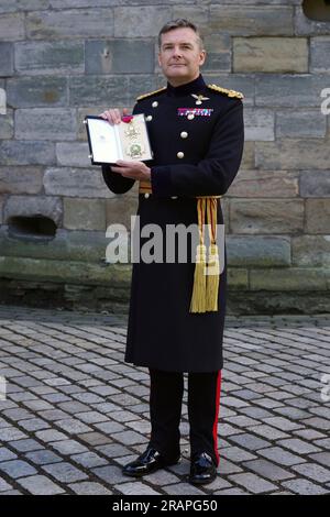 Lieutenant General Sir Nicholas Borton holds his medal after being made ...