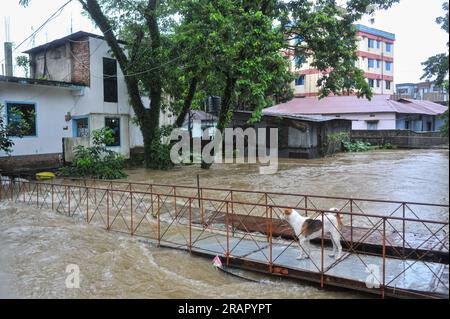 A submerged steel bridge over a big canal during the heavy rainfall ...