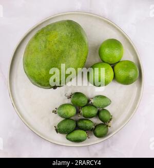 Feijoa on a yellow background. Green fruit on yellow. Feijoa background ...