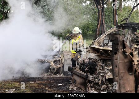 A Ukrainian firefighter extinguishes fire in apartment block damaged in ...