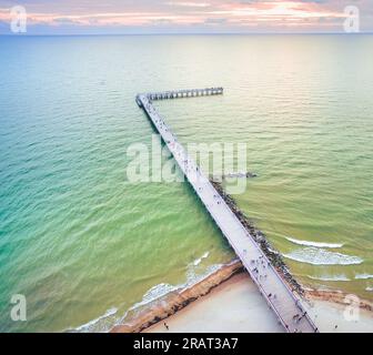Colorful sunset and Palanga resort pedestrian bridge, pier. Aerial ...