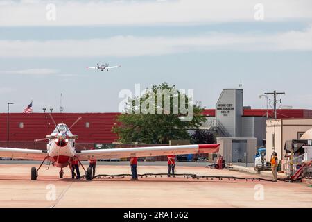A ground crew loads fire retardant into an air tanker at the Boise ...