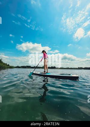 standing woman on supboard Stock Photo - Alamy