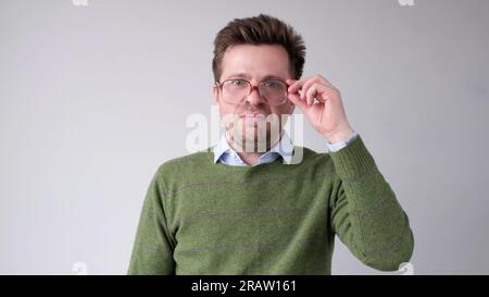 The angry European young man wearily looks. He is without strength and ...