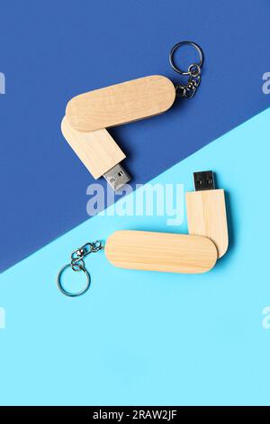 Wooden USB flash drives on turquoise and black background Stock Photo ...