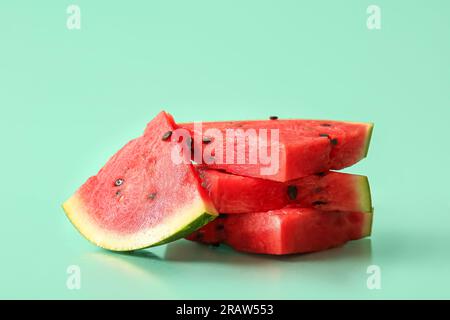 Pieces of fresh watermelon on turquoise background Stock Photo - Alamy
