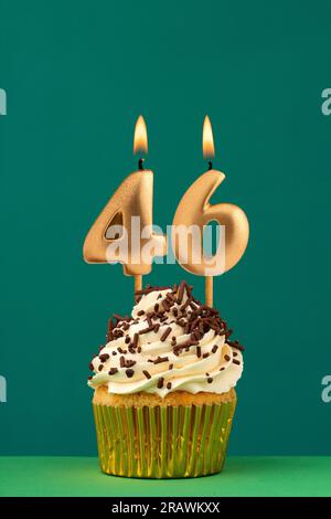 Birthday number 46 - Green birthday candle on white background Stock ...