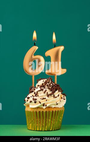 Birthday candle number 61 - Anniversary cupcake on black background ...