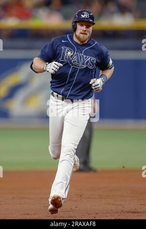 Tampa Bay Rays' Luke Raley follows through on a double during the ninth ...