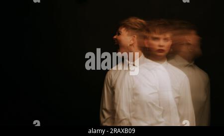 psychopath with mental disorders and insanity on a dark background. A ...