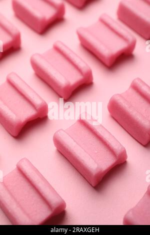 Tasty chewing gums on pink background Stock Photo - Alamy