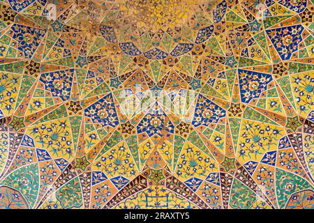 Colorful kashi-kari or faience mosaic decoration on minaret of mughal ...