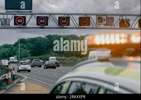 Variable speed signs showing a 60 mph speed limit on a gantry over a ...