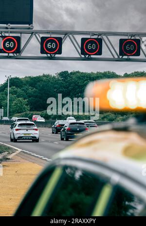warning matrix sign on gantry with "oncoming vehicle "and 20 mph speed ...