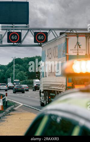 Variable speed signs showing a 60 mph speed limit on a gantry over a ...