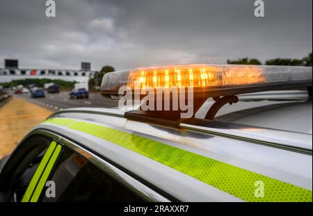 warning matrix sign on gantry with "oncoming vehicle "and 20 mph speed ...
