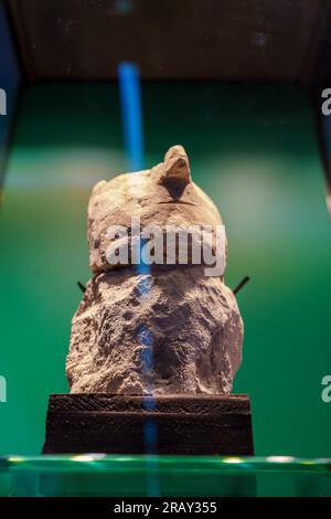 Monolithic figure in schematic relief Stock Photo - Alamy