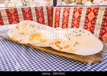 Turkish crusty flatbread on a table in cafe or bakery Stock Photo - Alamy
