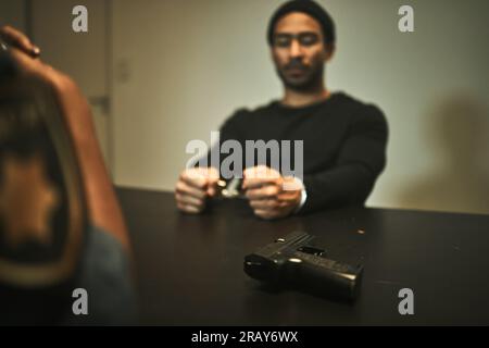 Interrogation, worry and criminal with handcuffs in jail for ...