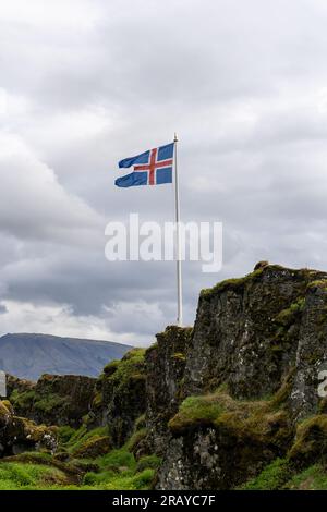 Icelandic flag waving in the wind with blue sky Stock Photo - Alamy