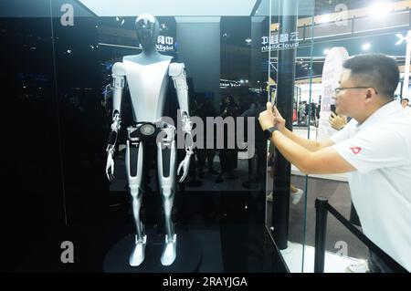 SHANGHAI, CHINA - JULY 6, 2023 - Spectators look at Tesla's "Optimus ...