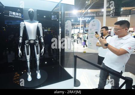 SHANGHAI, CHINA - JULY 6, 2023 - Spectators look at Tesla's "Optimus ...