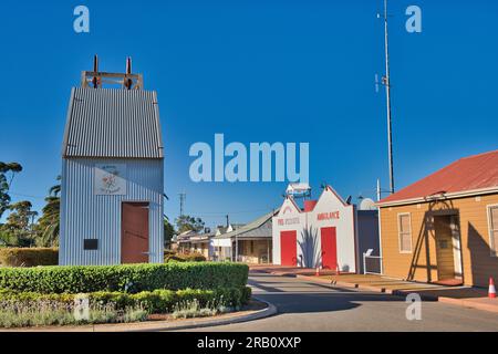 Street scene (Wolfram Street) with shop fronts and palm trees in the ...