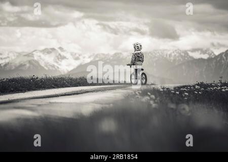 Little girl with running wheel Stock Photo - Alamy