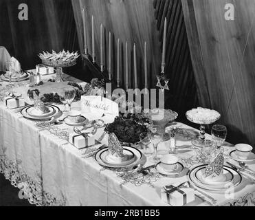 Table setting for Hanukkah Jewish holiday. Plate and cutlery on a white ...