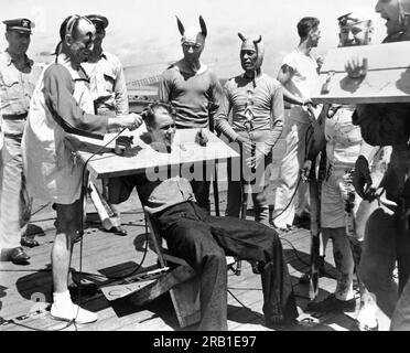 Pacific Ocean: October 15, 1942 The court of Neptunus Rex, Ruler of the ...
