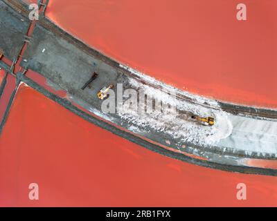Salt farm excavator top view with salt hill Stock Photo - Alamy
