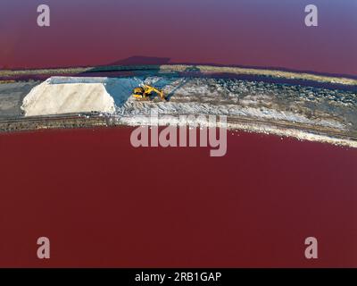 Salt farm excavator top view with salt hill Stock Photo - Alamy