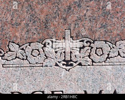 Engravings on grave stone Stock Photo - Alamy