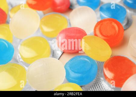 Blisters and many colorful cough drops as background, closeup Stock ...