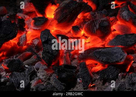 Pieces of hot smoldering coal as background, closeup Stock Photo - Alamy