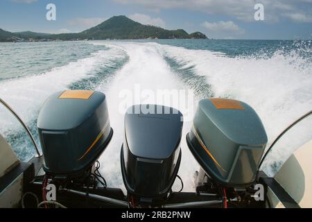 Three powerful engines mounted on the speedboat Stock Photo - Alamy
