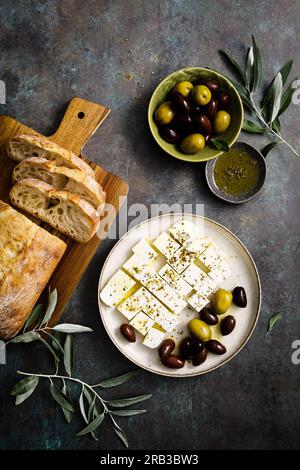 Feta cheese, olives and ciabatta, top view Stock Photo - Alamy