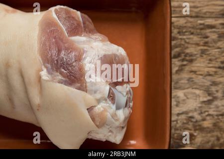 An uncooked British gammon shank that will be used to make a homemade ...