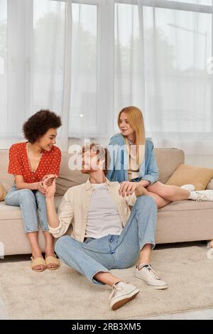 polyamorous family, love triangle, cheerful multicultural women and ...