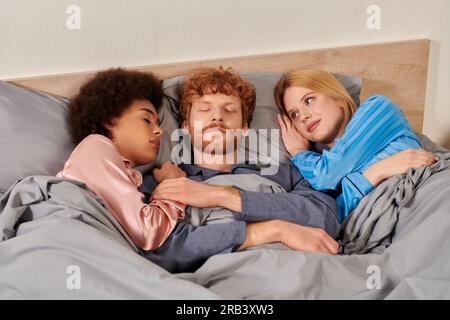 polyamorous relationship, cultural diversity, redhead man raising hands ...