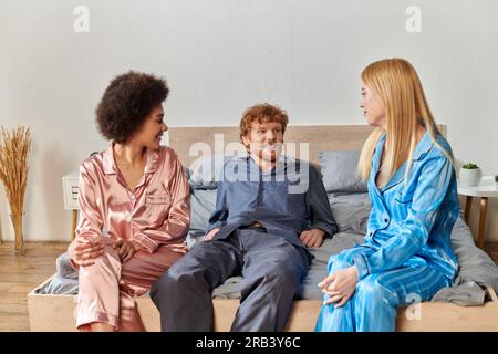 polyamorous relationship, cultural diversity, redhead man raising hands ...
