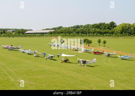 Planes on display at a wings and wheels fly-in event in the countryside ...