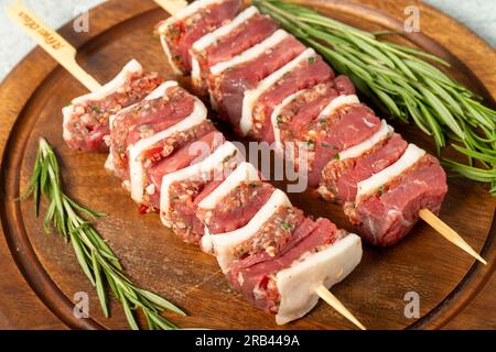 Beef skewer. Shish kebab prepared with raw ribeye and minced meat ...
