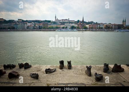 Statue of shoes abandoned at the waterfront of the Danube representing ...